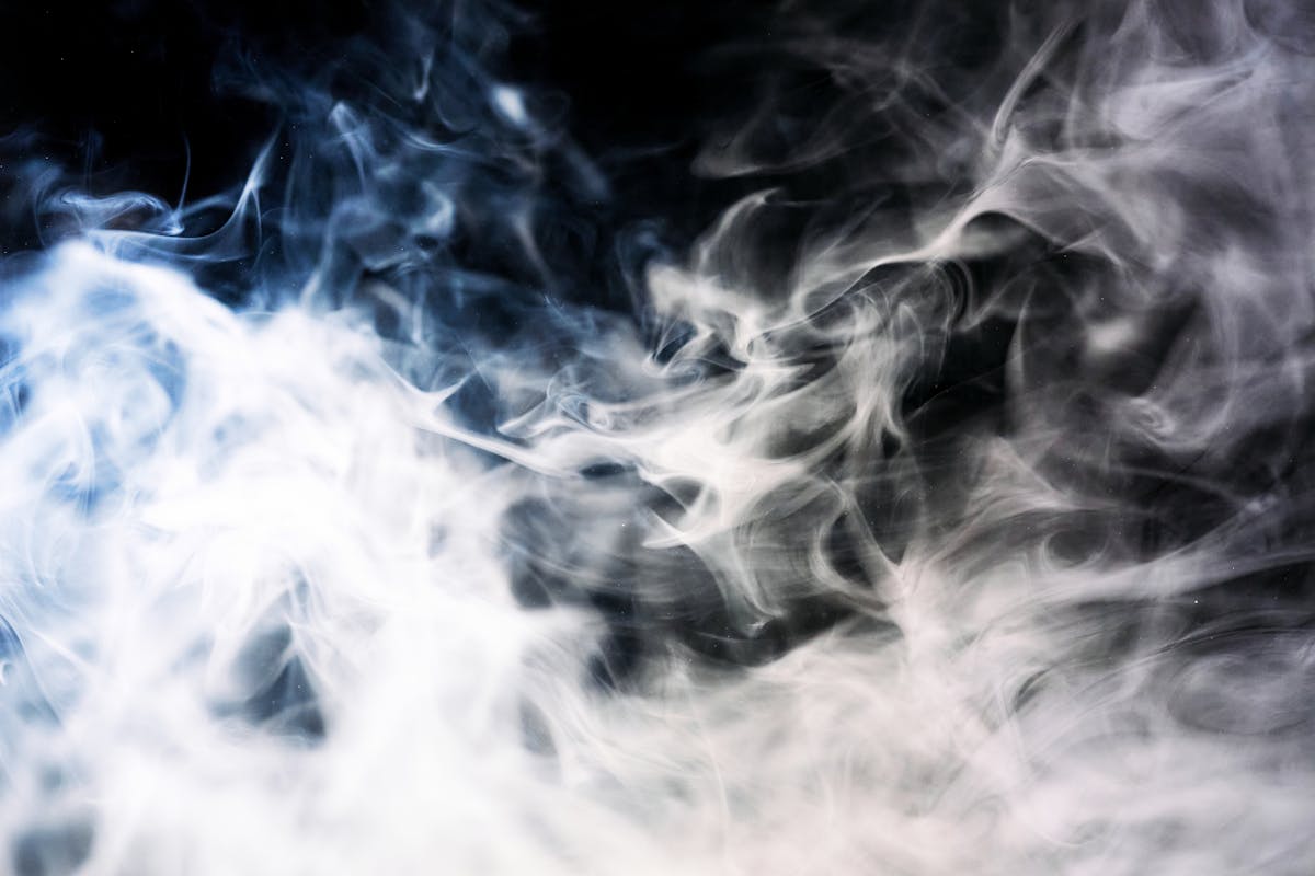 Captivating image of ethereal smoke swirls with dark and light contrasts