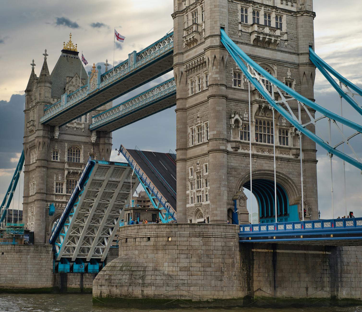 Tower Bridge bascules raised high to allow a tall ship to pass underneath