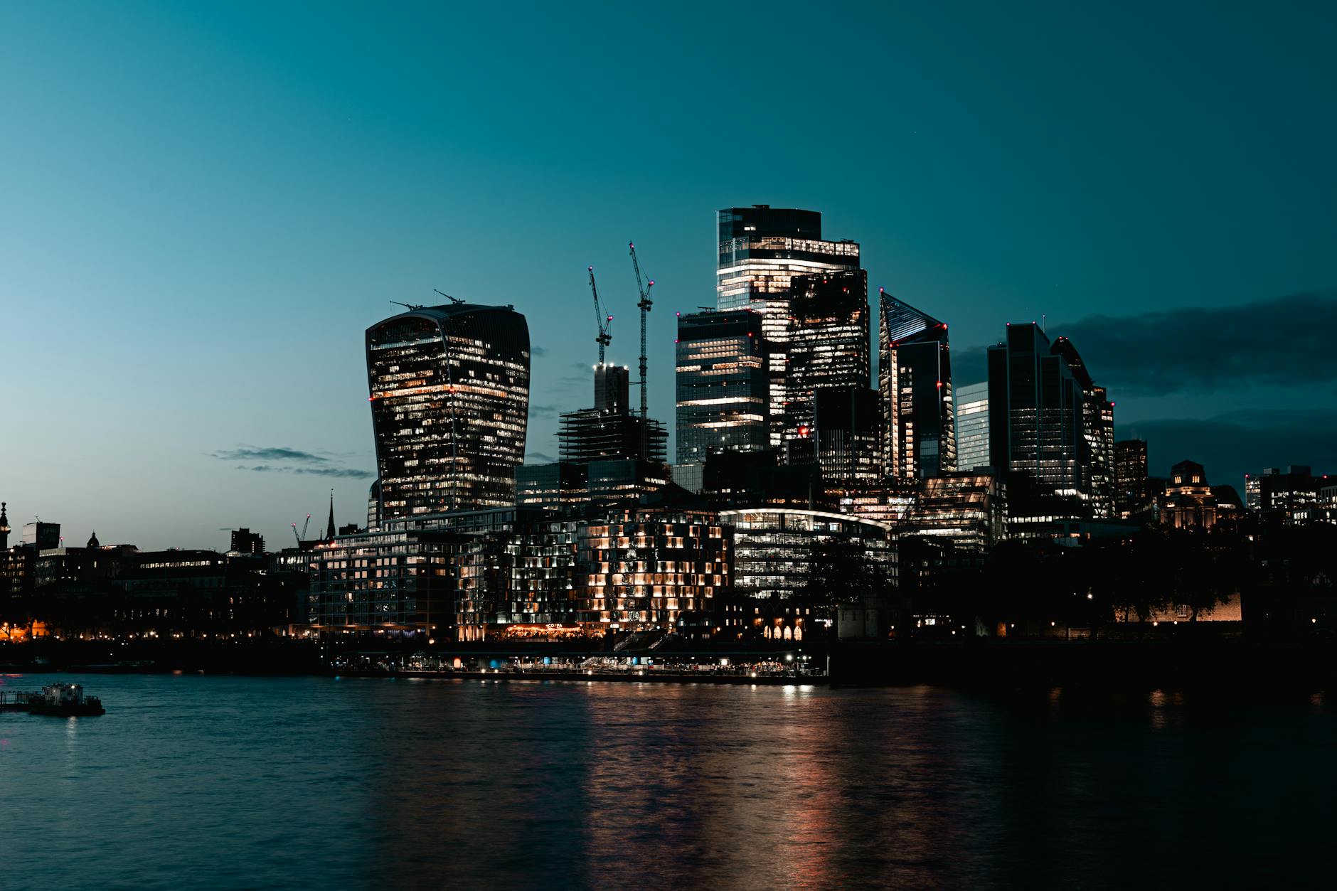 London illuminated skyline at dusk on the Thames