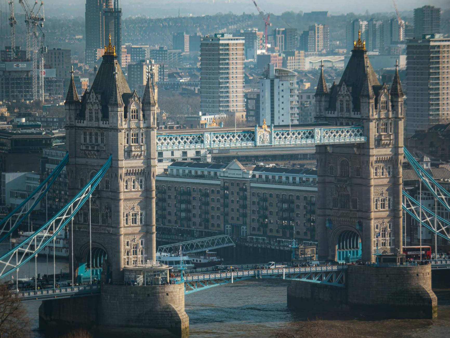 Drone shot of Tower Bridge with the City of London and Shard visible in the background