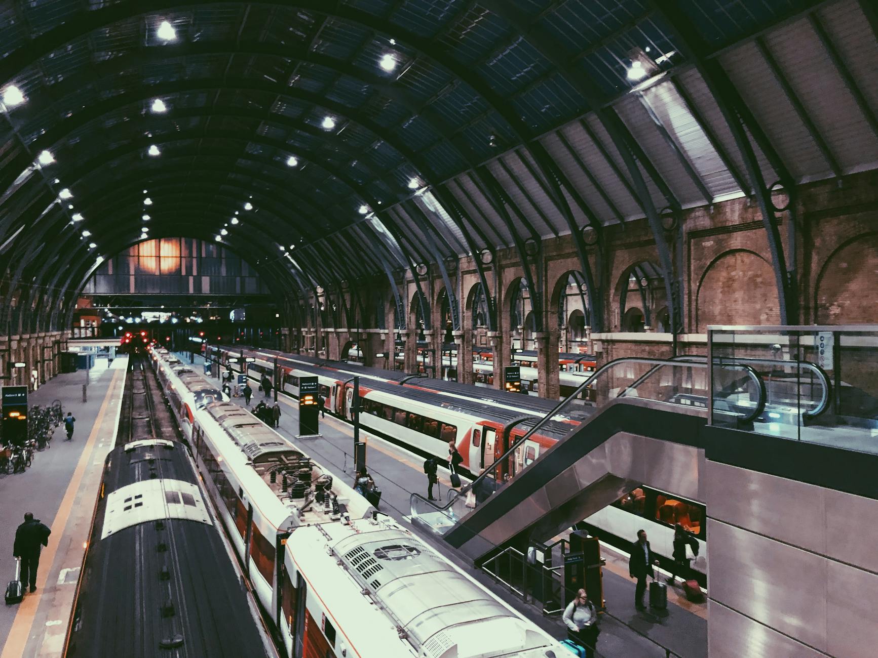 Commuters walking through a busy English train station