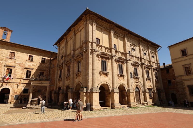 Sunlit Renaissance palace with columns in the main square of Montepulciano Tuscany