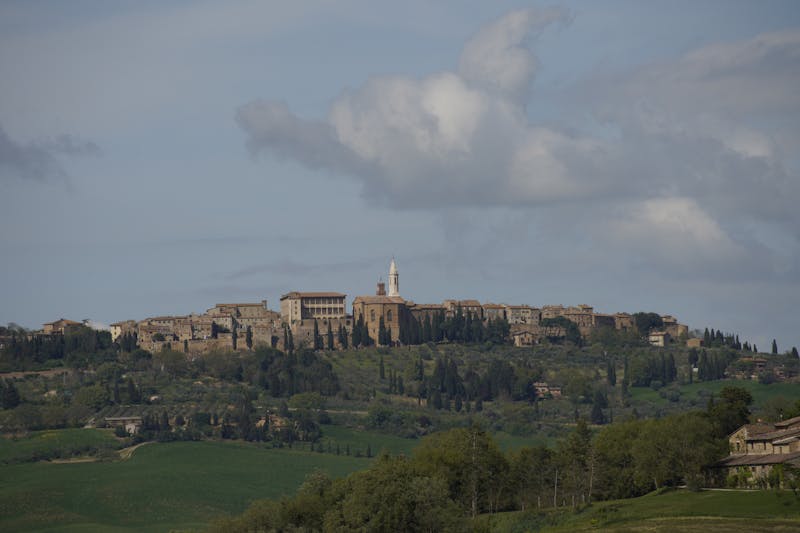 Panoramic view of the historic Renaissance town of Pienza Tuscany with stone buildings and bell tower
