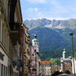 Colorful buildings in Innsbruck Austria with mountains