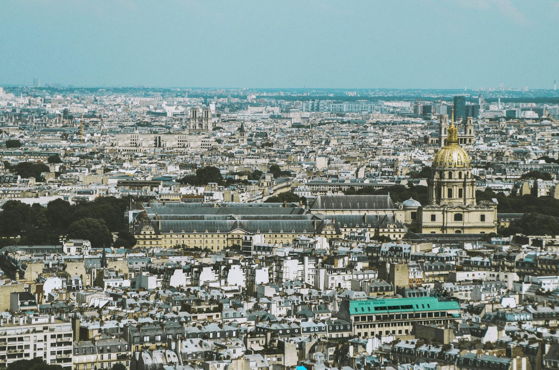 Panoramic view of Paris featuring the dome of Les Invalides with the city stretching behind it