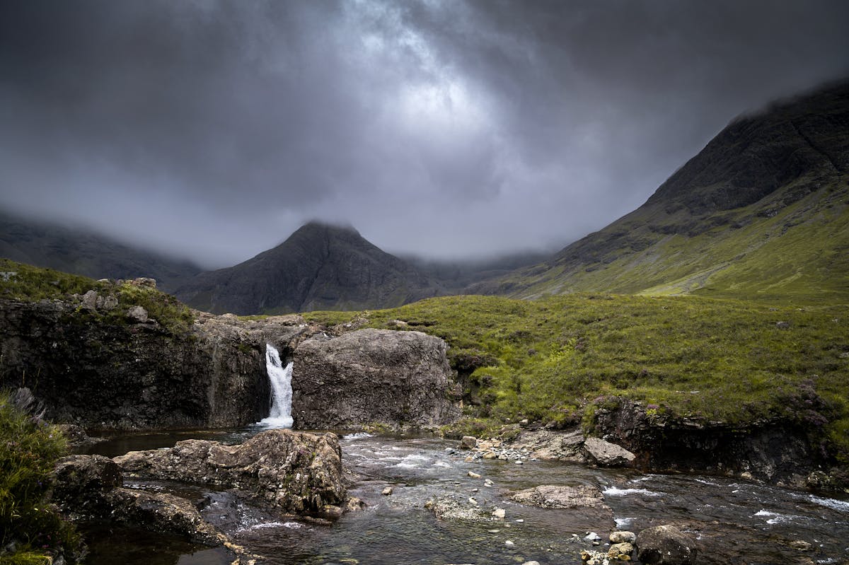 Waterfall at the Fairy Pools on the Isle of Skye under storm clouds