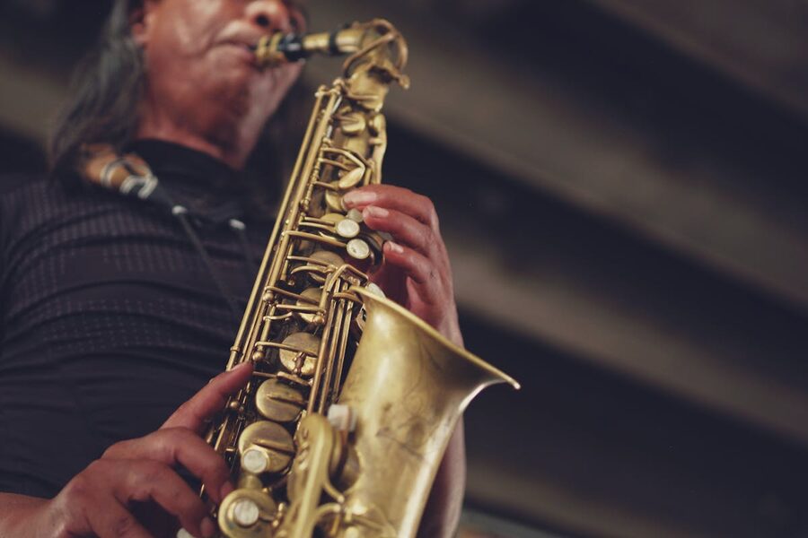 Close-up of a jazz musician performing with a saxophone during live performance