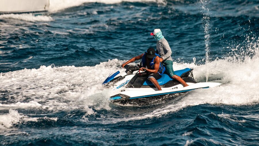 Exciting jet ski adventure in open ocean waters with spray