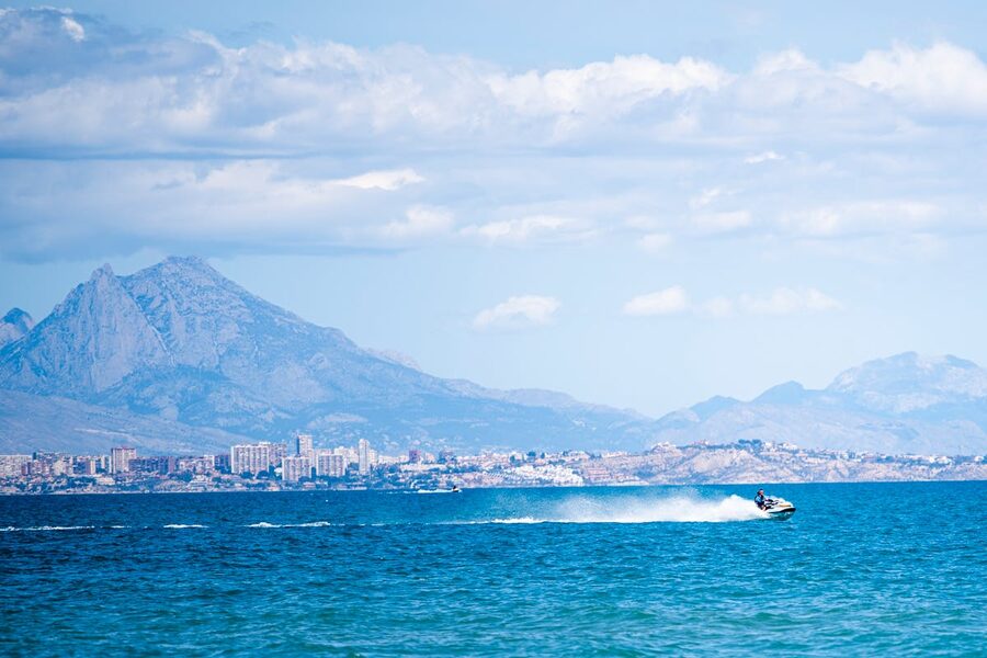 Jet ski riding along the coastline of Spain