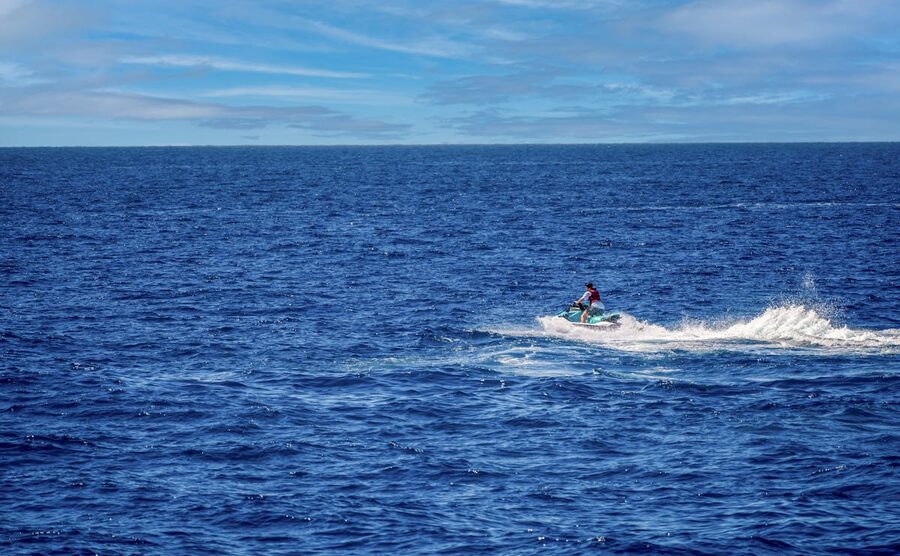 Jet ski on the sea with waves splashing