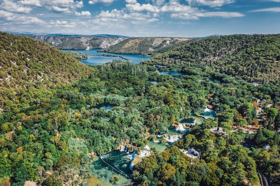 Aerial view of lush greenery and waterfalls in Krka park
