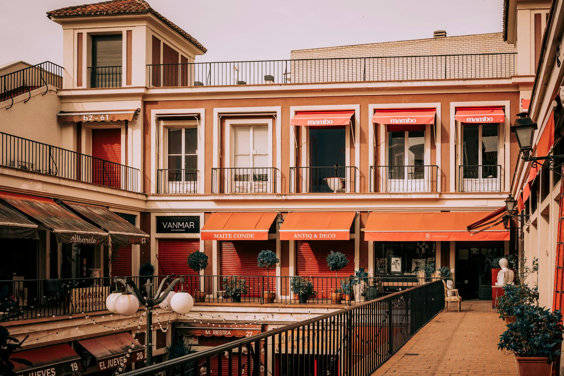 Urban courtyard in La Latina Madrid with shops and awnings