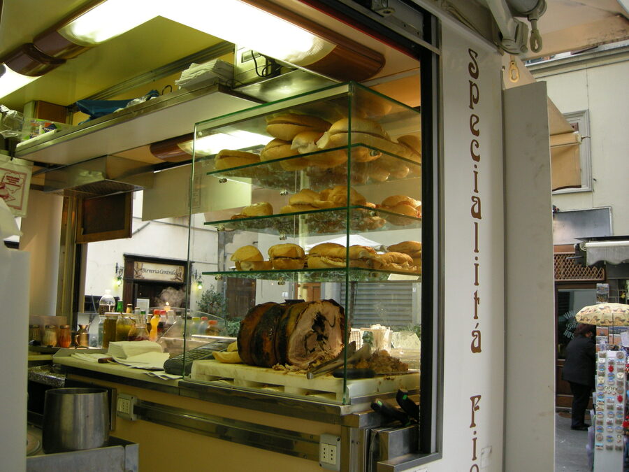 Traditional lampredotto street food cart with vendor in Florence Italy