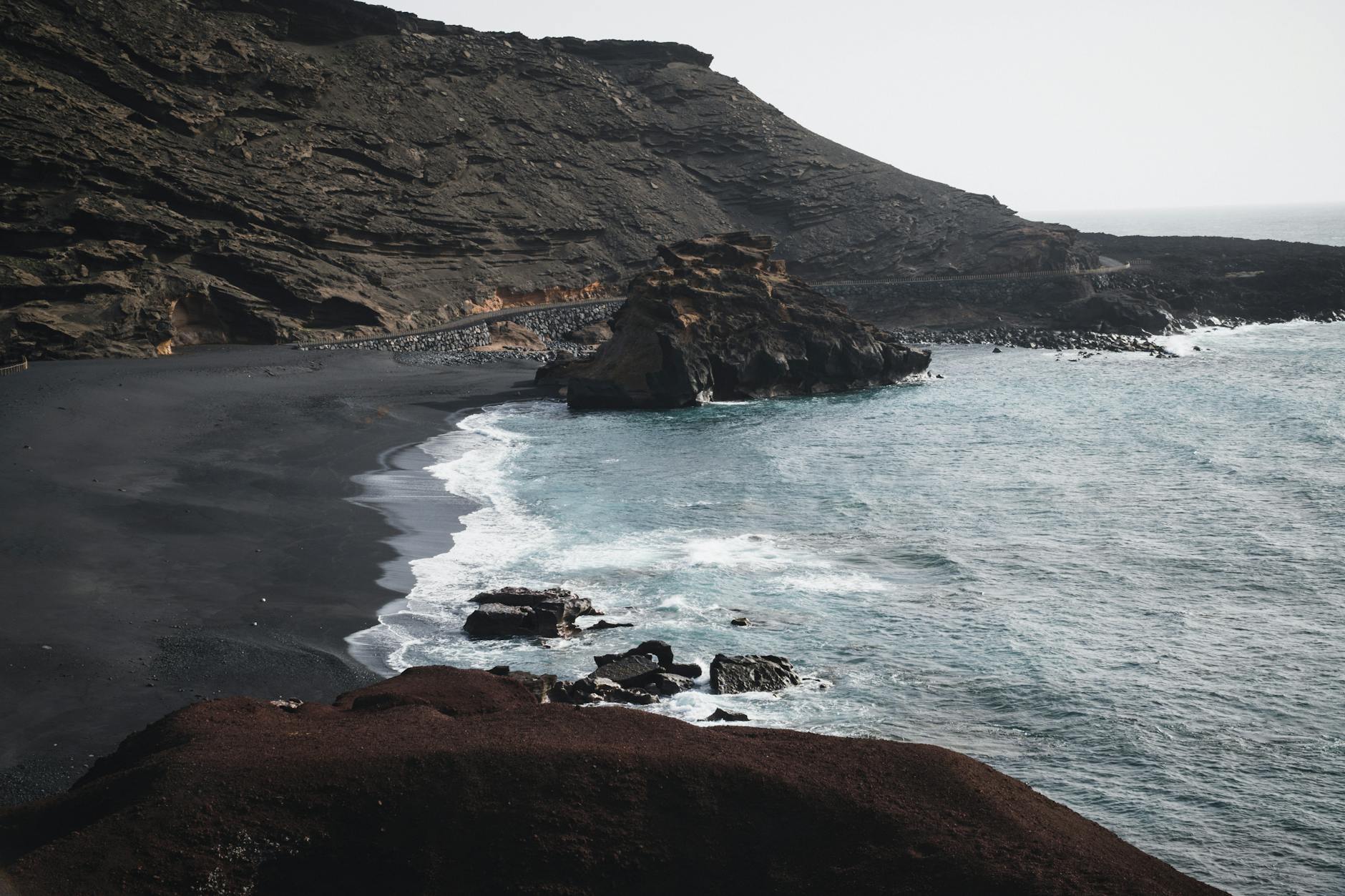 Black sand beach and rugged coastline in Lanzarote