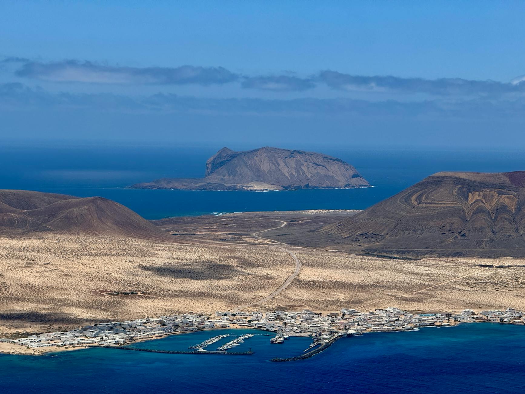 Aerial view of Lanzarote landscape with La Graciosa island in the distance