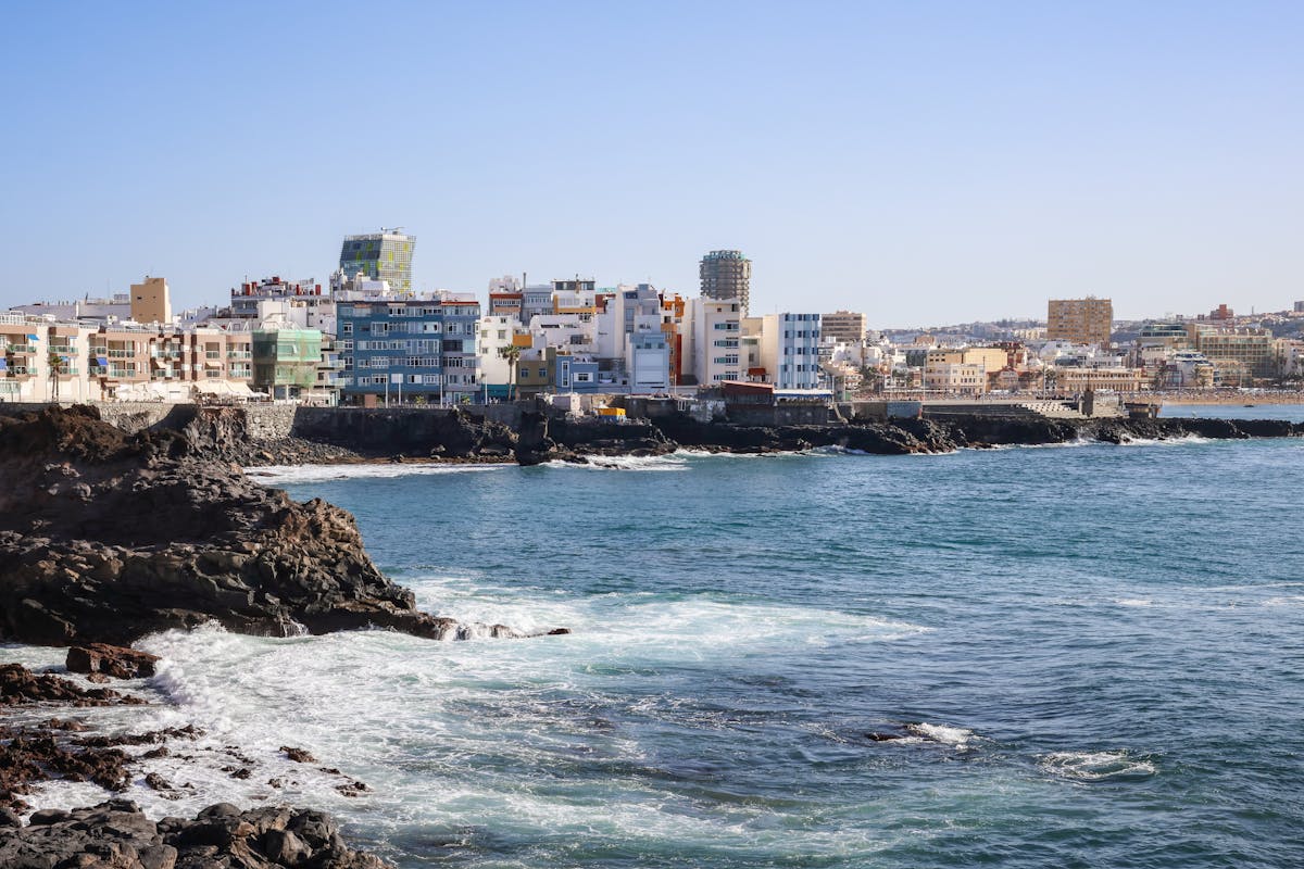 Colorful cityscape of Las Palmas de Gran Canaria on a sunny day overlooking the coast