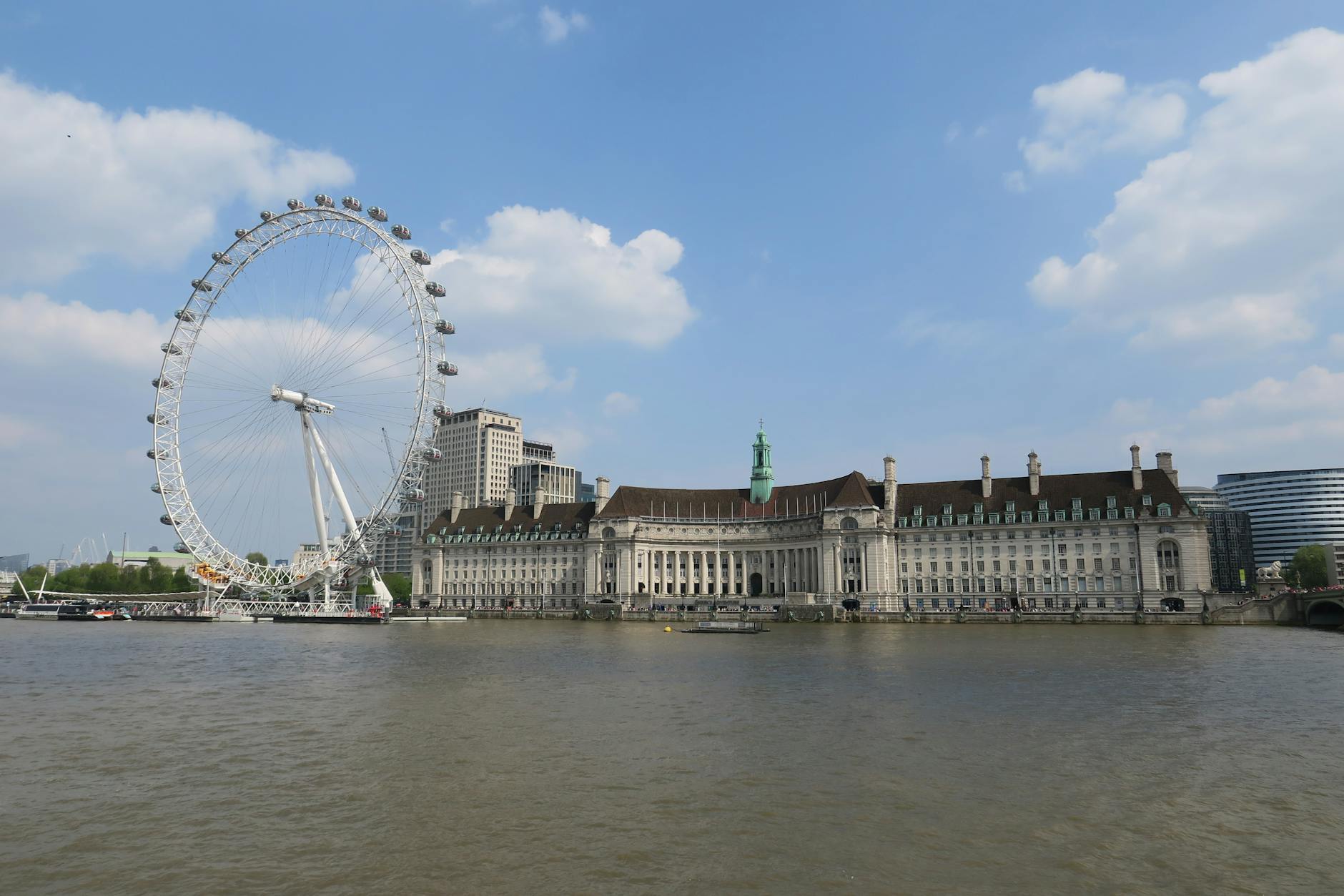 London Eye and County Hall along the River Thames on a sunny day
