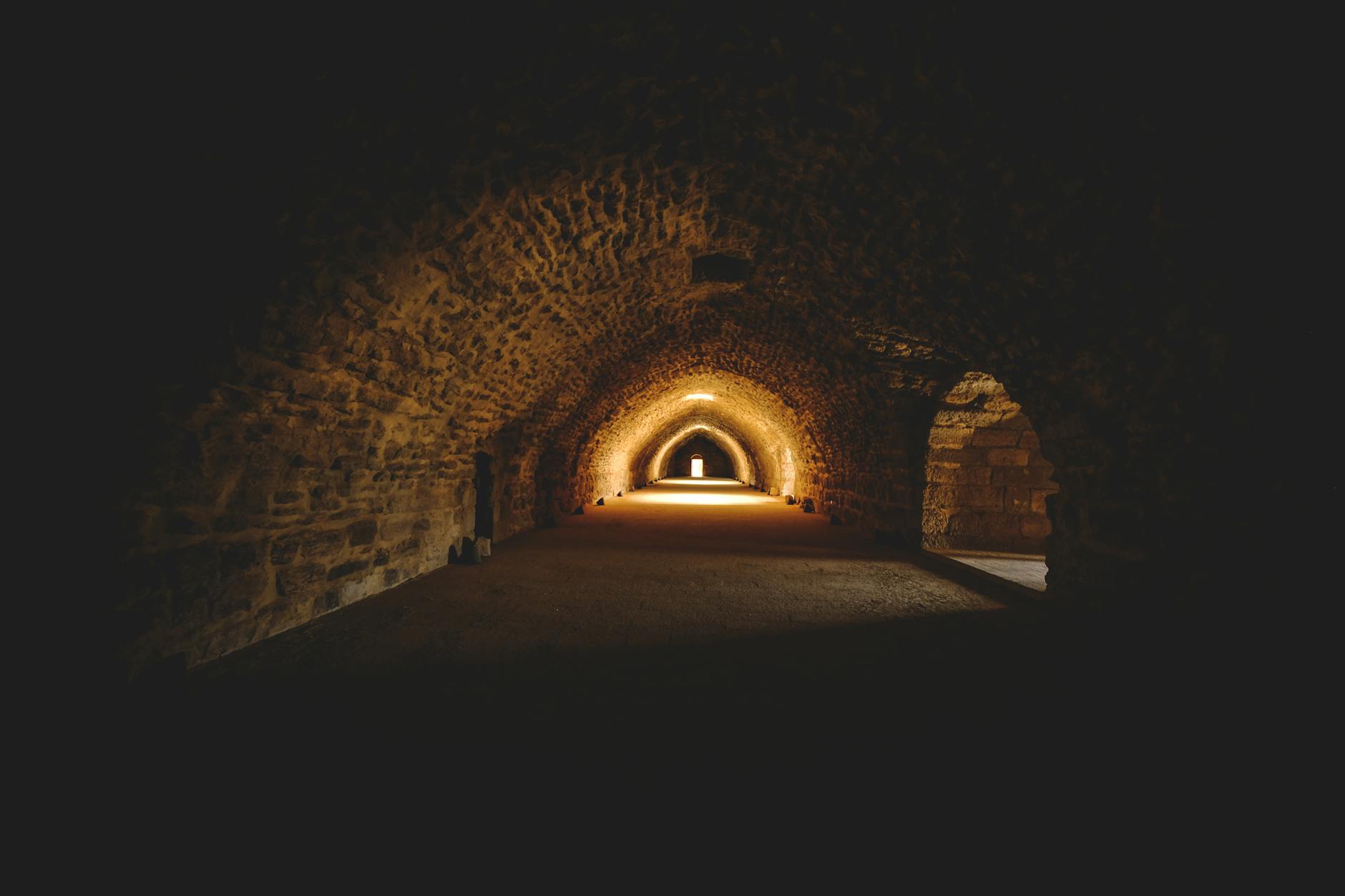 Gothic tunnel with warm atmospheric lighting