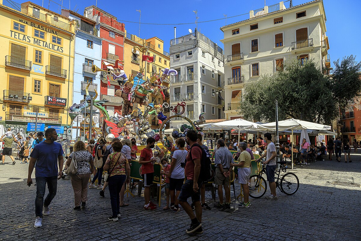 Brightly illuminated street decorations and light displays during Las Fallas festival at night in Valencia