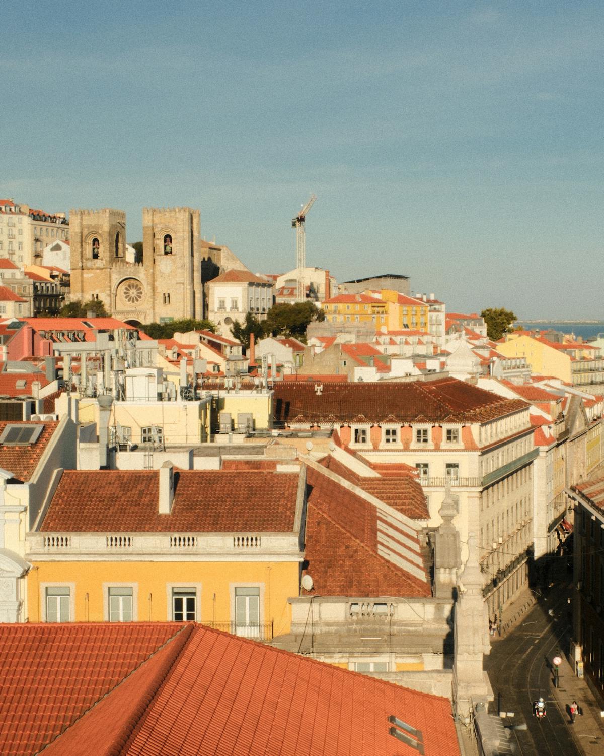 Aerial view of Lisbon Se Cathedral surrounded by the city terracotta rooftops