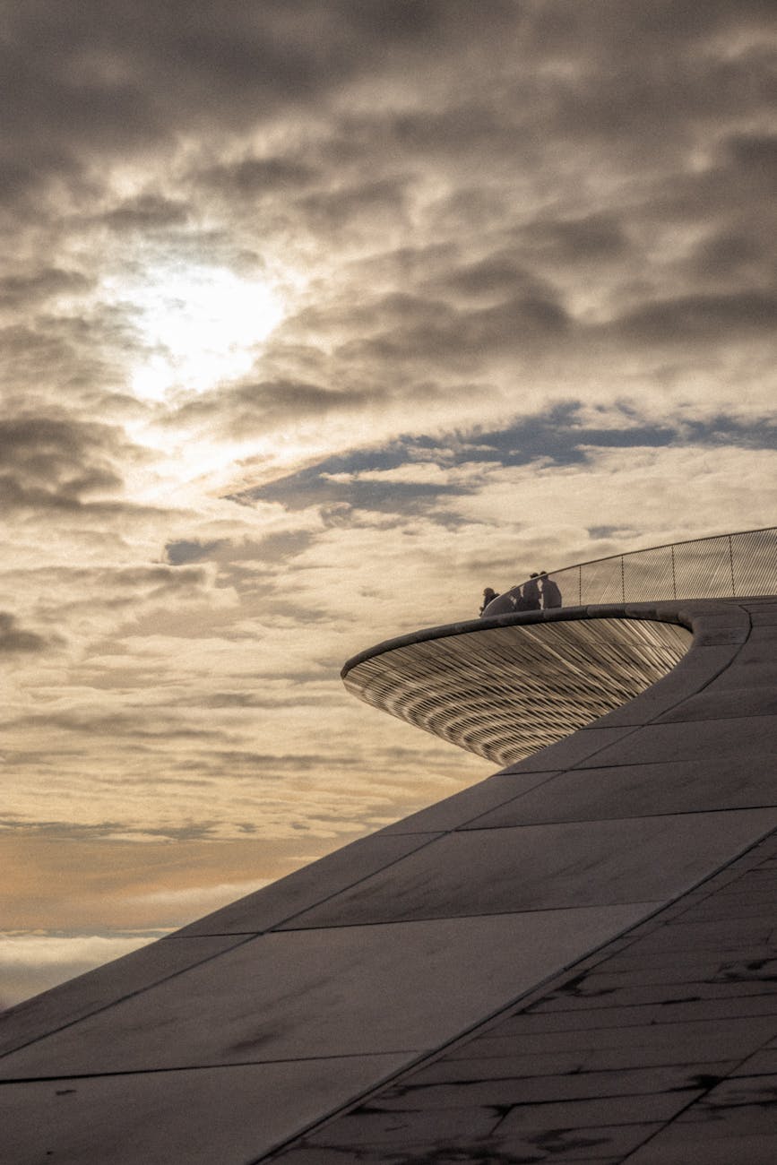 View of Lisbon rooftops and the April 25th Bridge from a city viewpoint