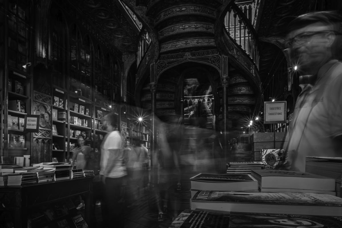 Atmospheric interior of the famous Livraria Lello bookstore in Porto with ornate staircase