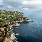 Aerial view of rocky coastline and turquoise waters along Lloret de Mar on the Costa Brava