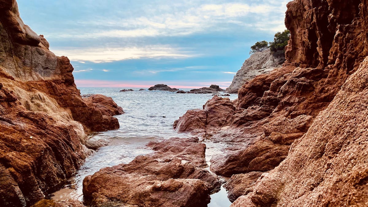 Rocky coastal scenery of Lloret de Mar Spain under a clear blue sky