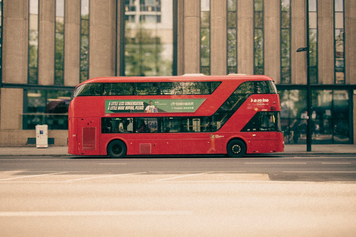 Double-decker bus driving through a London street