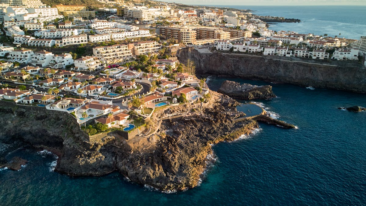 Aerial view of Los Gigantes cliffs meeting the Atlantic Ocean in Tenerife