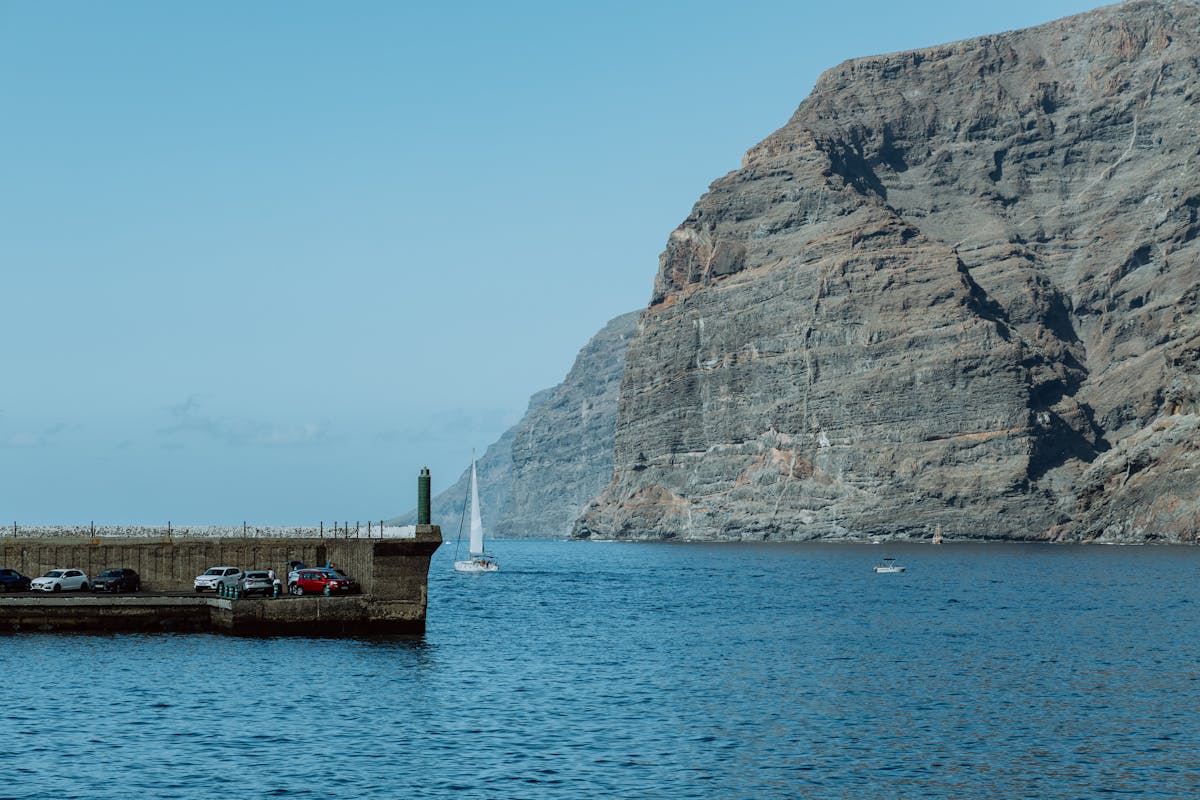Los Gigantes harbour with dramatic cliff backdrop and boats