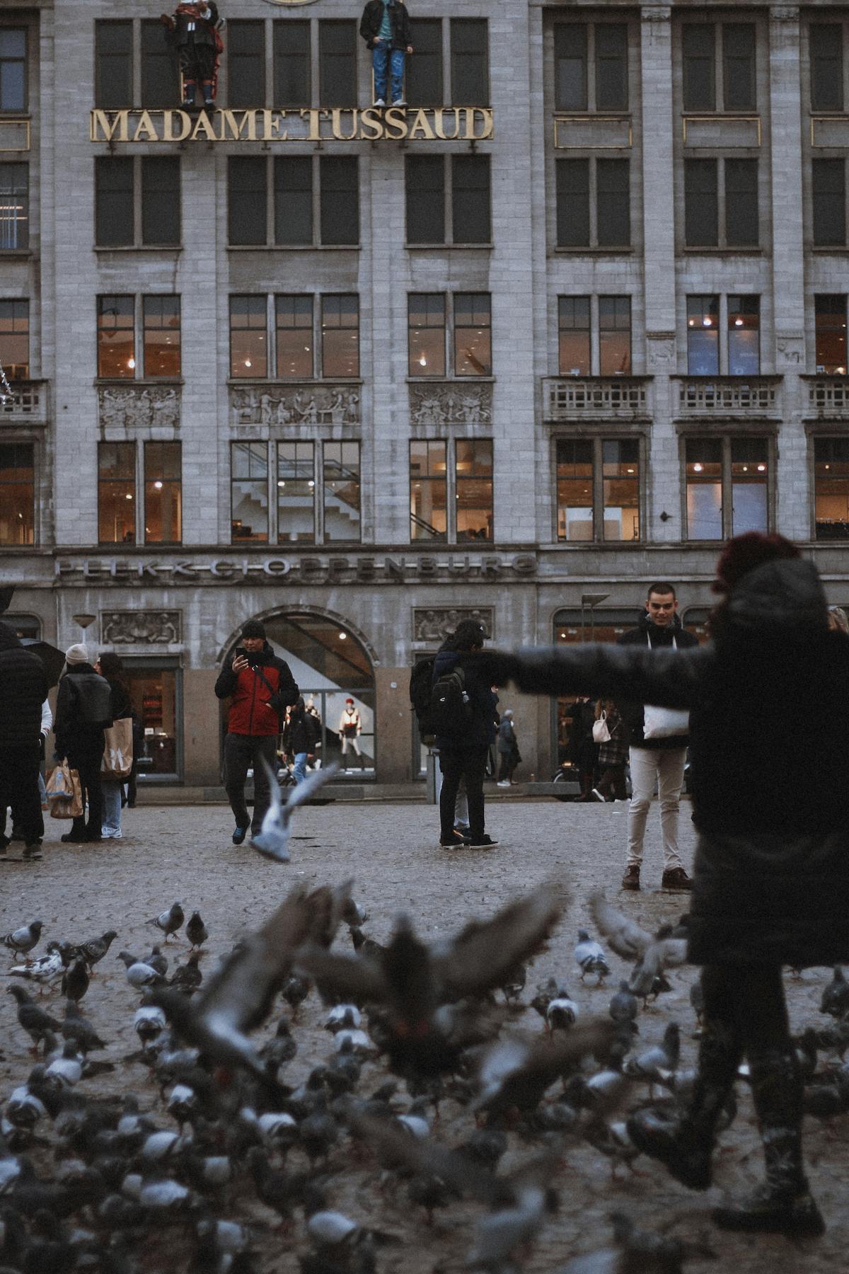 The Madame Tussauds building facing Dam Square in Amsterdam with visitors gathered outside