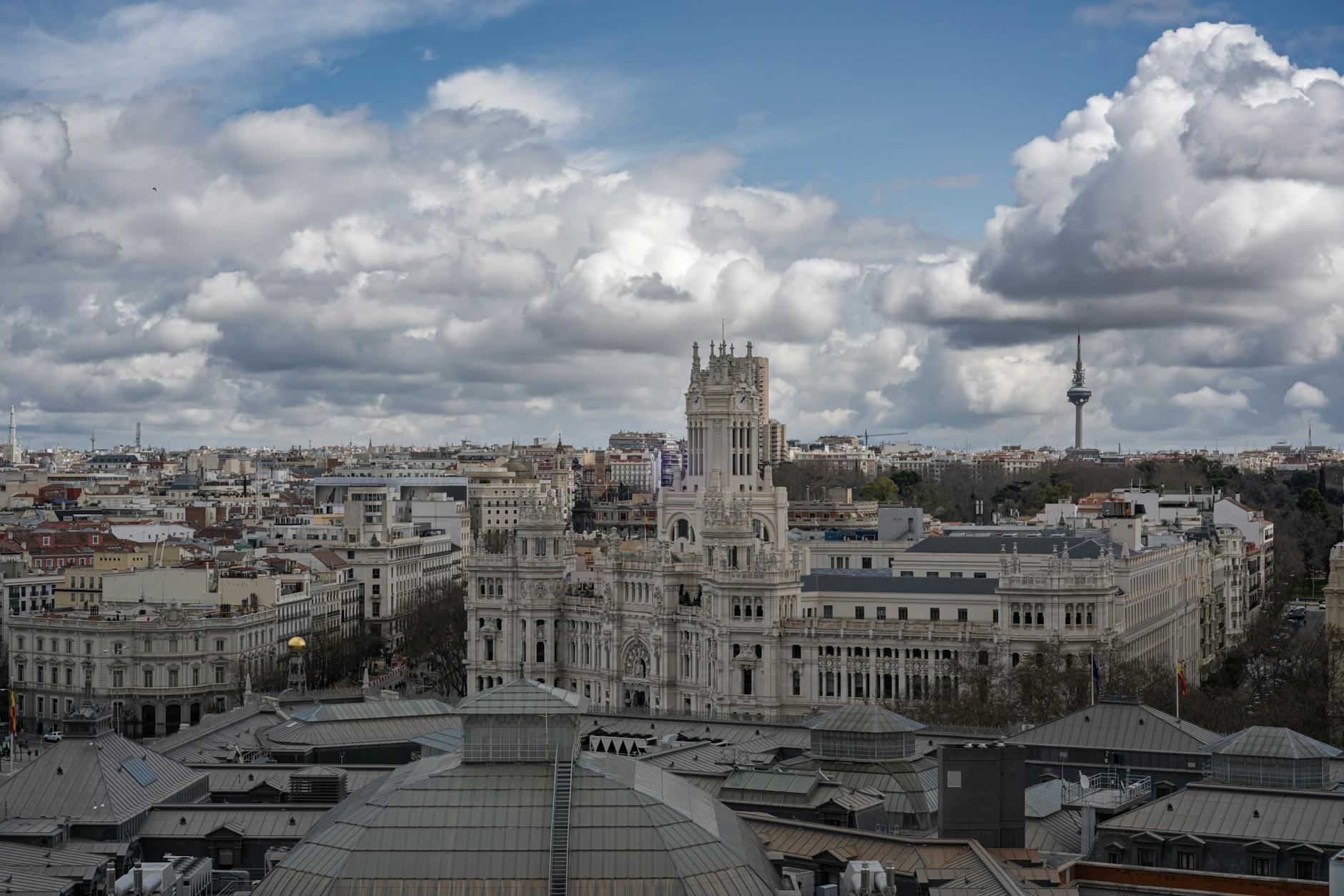 Aerial view of Madrid featuring the Palacio de Cibeles and surrounding cityscape