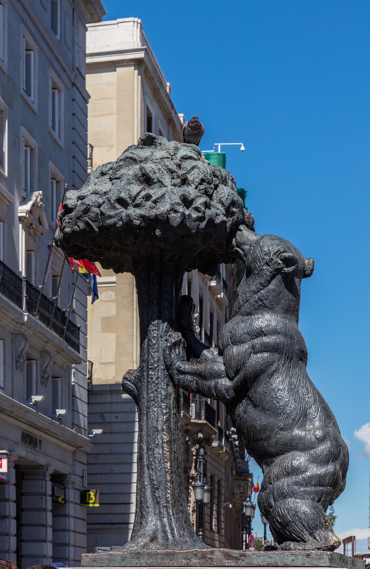The El Oso y el Madrono bronze statue of a bear reaching for a strawberry tree in Puerta del Sol Madrid