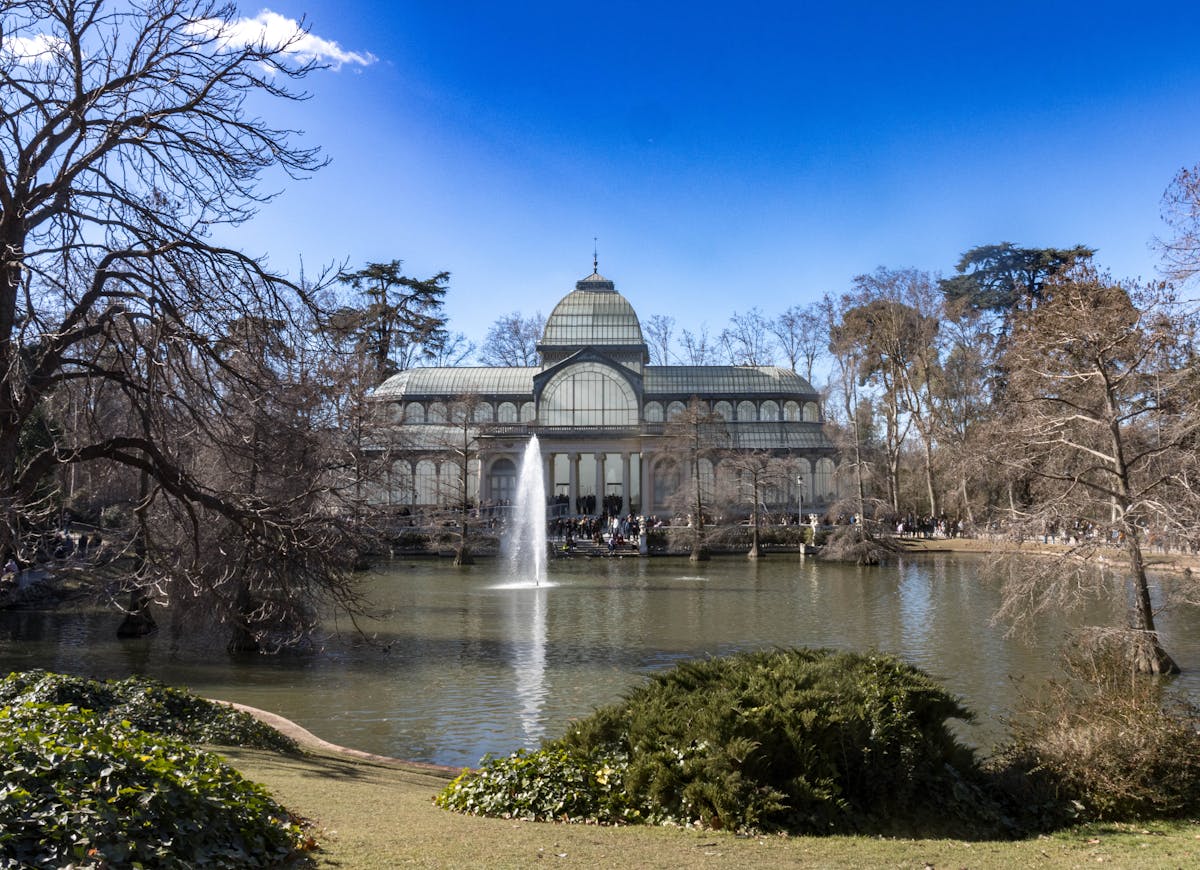 Crystal Palace in Retiro Park Madrid with reflecting pond