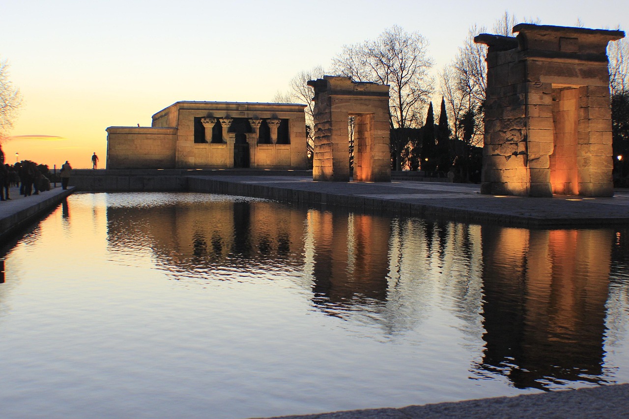 Temple of Debod in Madrid illuminated at night with reflection pool