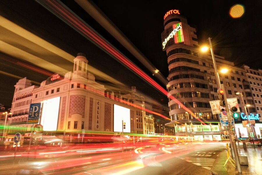 Long exposure of Callao Square in Madrid at night with light streaks