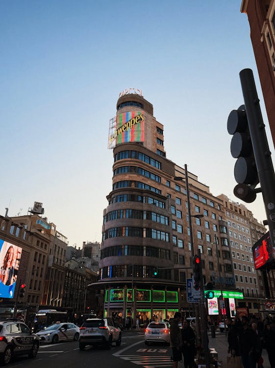 The Schweppes sign on the Capitol building in Madrid during sunset