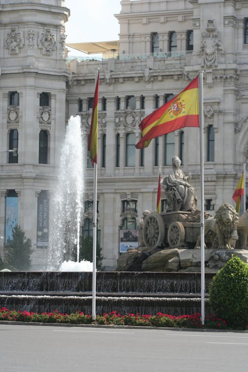 Cibeles Fountain with Spanish flags at the Palace of Communications Madrid