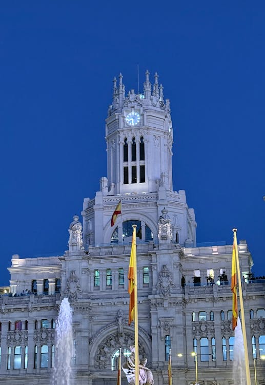 Cibeles Palace in Madrid glowing under the night sky