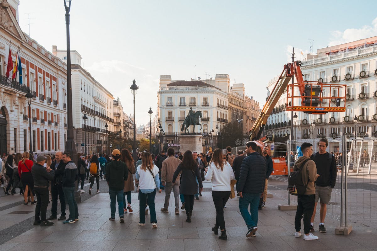 A downtown Madrid street with ornate historic buildings and pedestrians