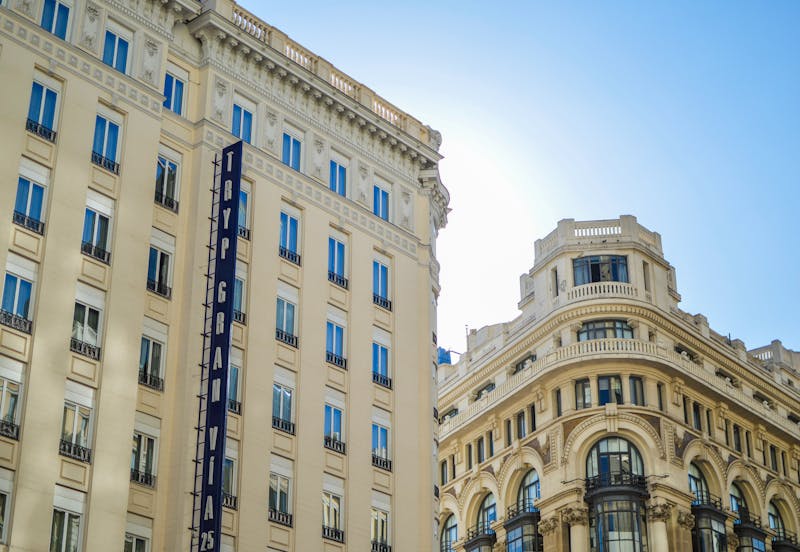Gran Via street in Madrid showing iconic classic urban architecture under clear skies