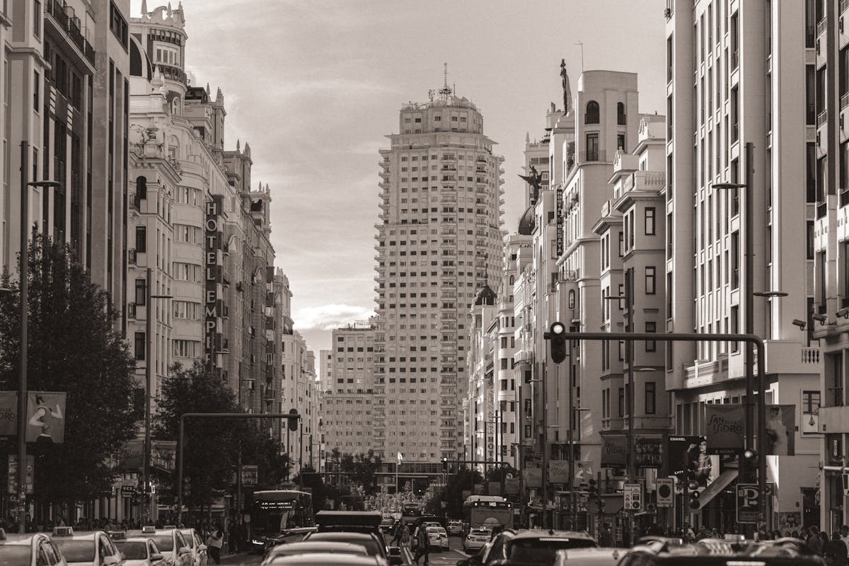 Gran Via boulevard in Madrid lined with ornate early 20th century buildings and traffic