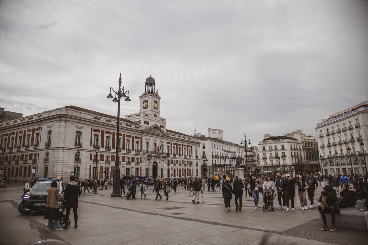 Busy Puerta del Sol square in Madrid with crowds of tourists and locals