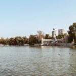 Monument and lake at El Retiro Park in Madrid Spain