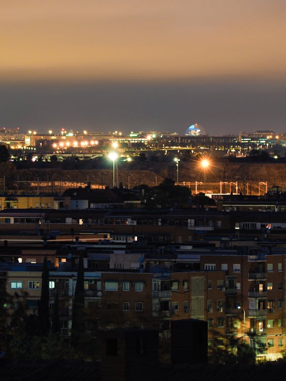 Madrid skyline seen from a distance with city lights at night