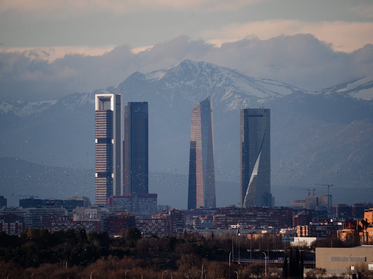 Madrid skyline with the snow-capped Sierra de Guadarrama mountains visible in the distance