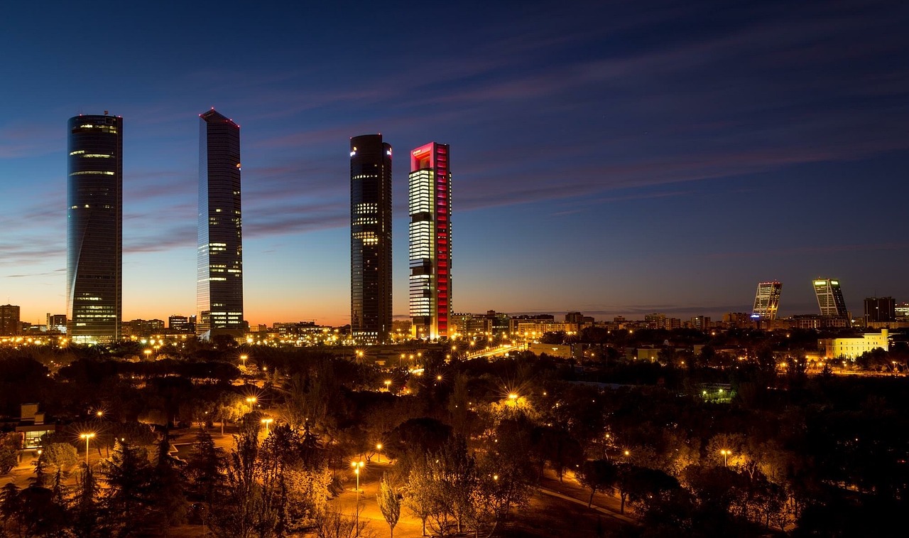 Madrid skyline at night with illuminated skyscrapers