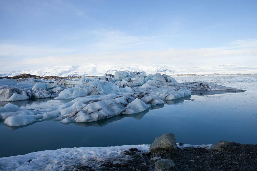 Majestic icebergs float in the tranquil waters of Jökulsárlón Glacier Lagoon, Iceland.
