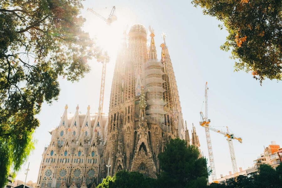 Looking up at the ornate spires and facade details of the Sagrada Familia